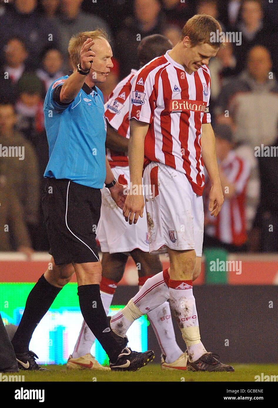 Stoke City's Ryan Shawcross is visibly upset after being shown a red ...