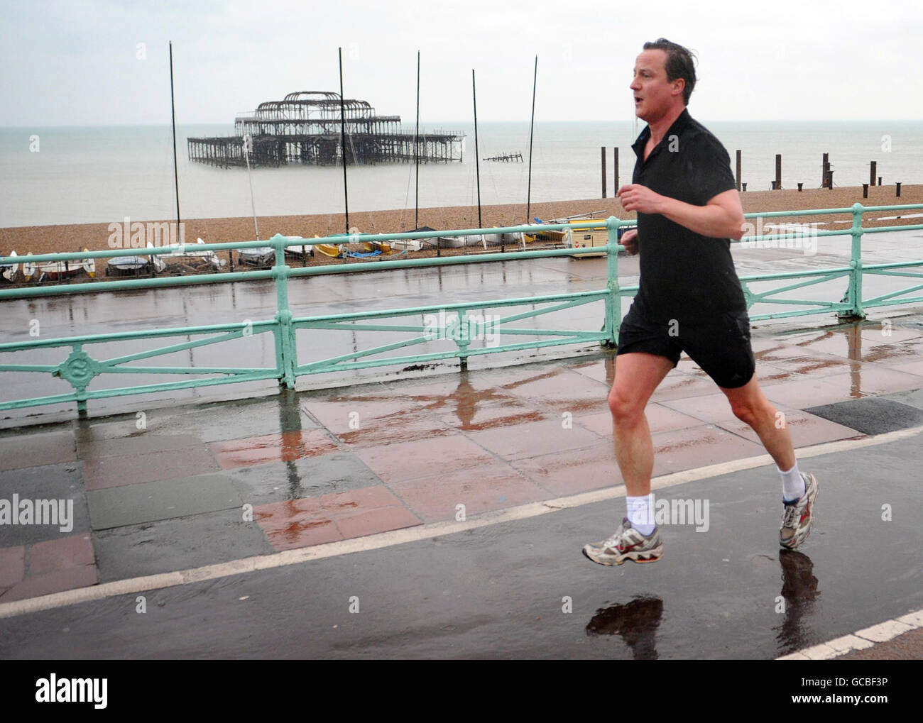 Conservative Party leader David Cameron takes a run along the sea front ...