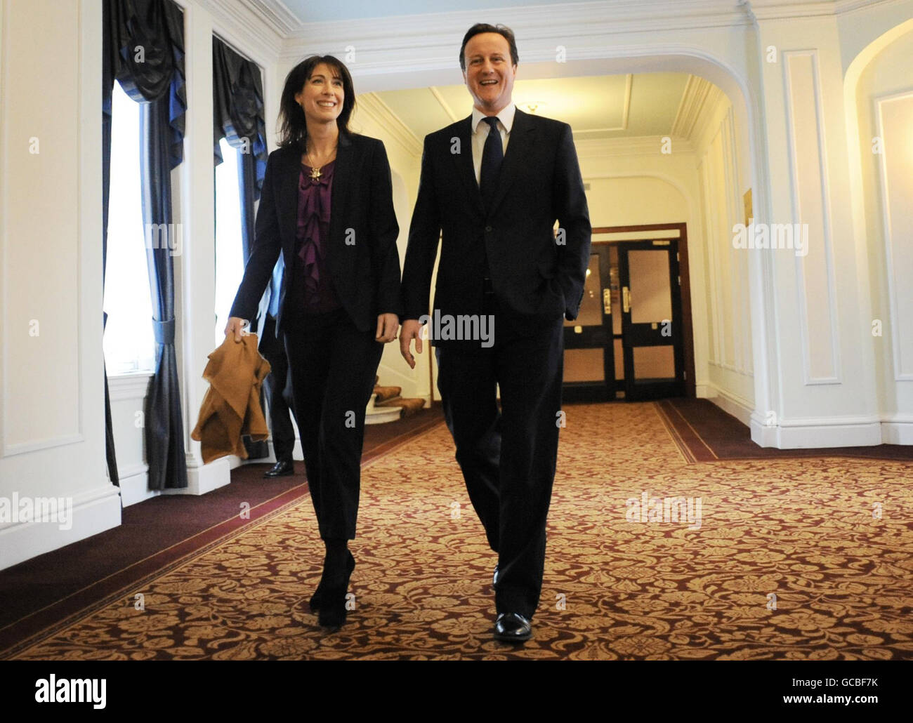 Conservative Party leader David Cameron arrives with his wife Samantha ...