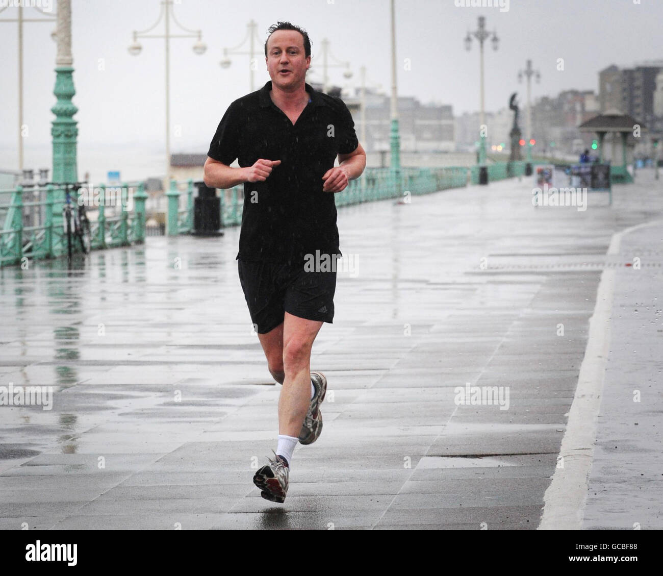 Conservative Party leader David Cameron takes a run along the sea front ...