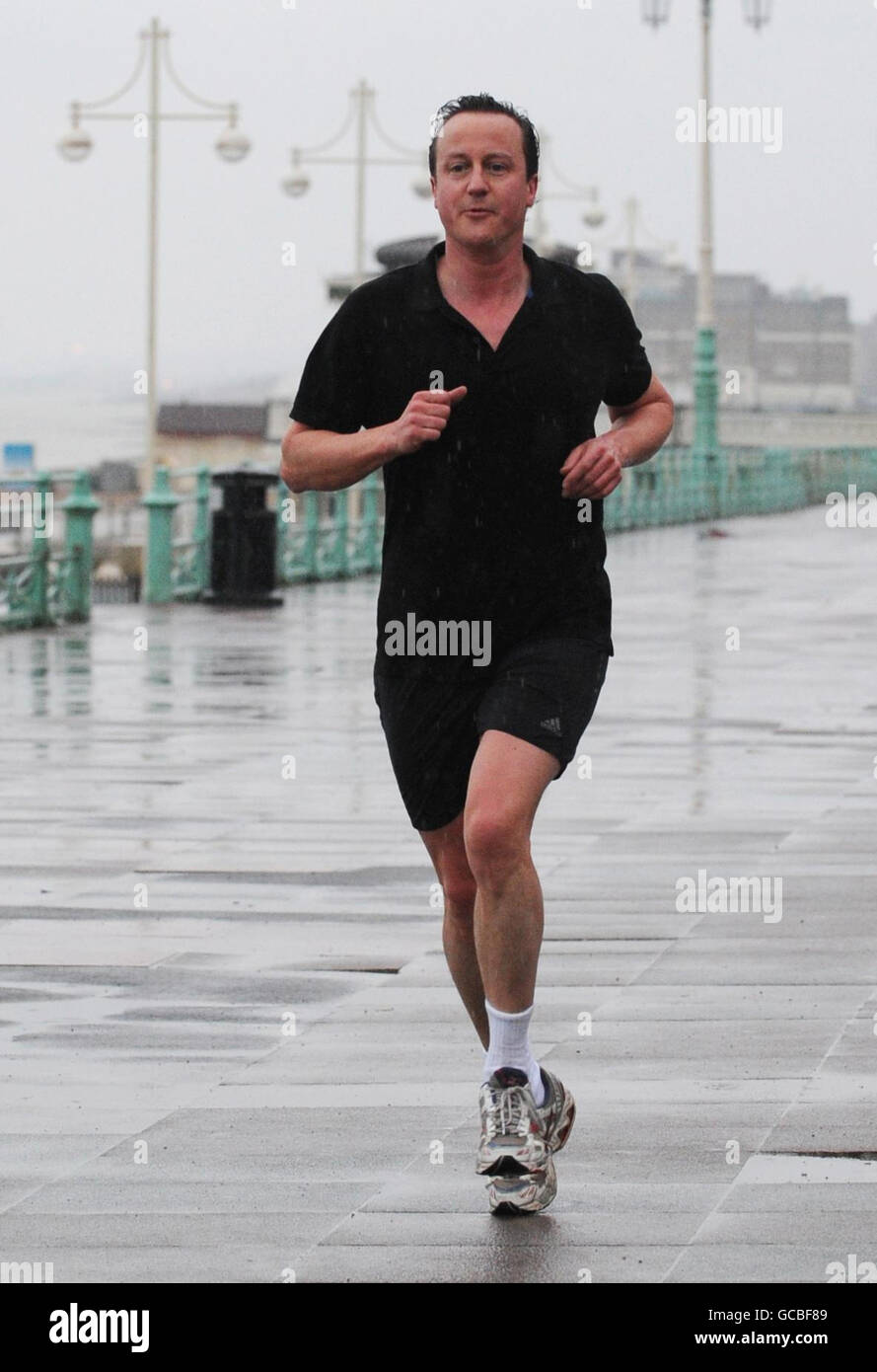 Conservative Party leader David Cameron takes a run along the sea front ...