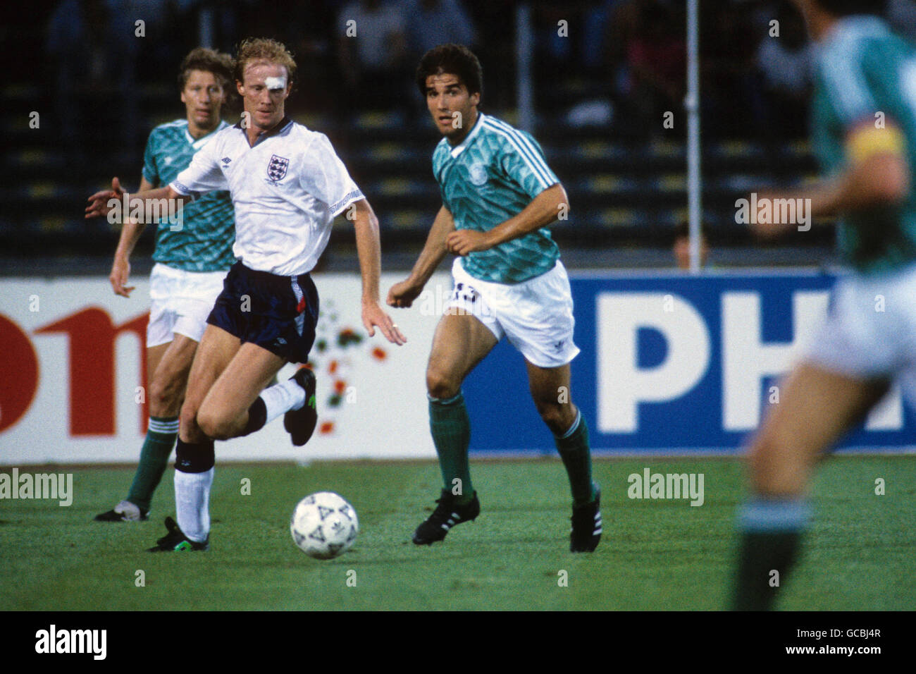 West Germany's Karl-Heinz Riedle come sunder pressure from England's ...
