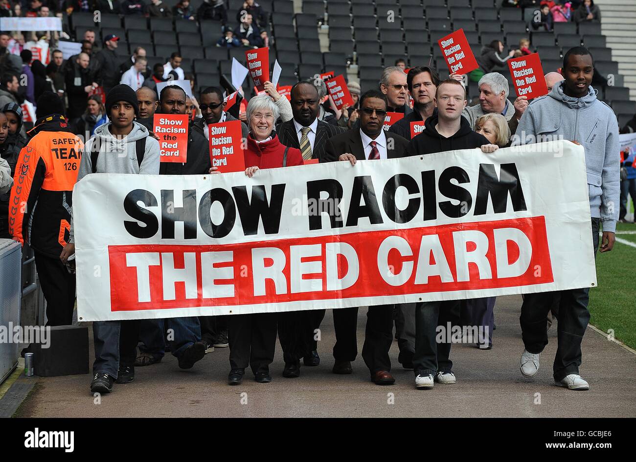 Fans parade a banner saying Show Racism the Red Card before kick off Stock Photo - Alamy