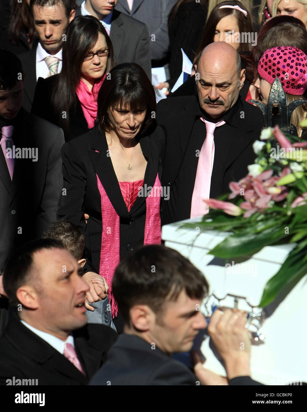 Kim Wise,(centre) accompanied by her father Keith Wise, (third left ...