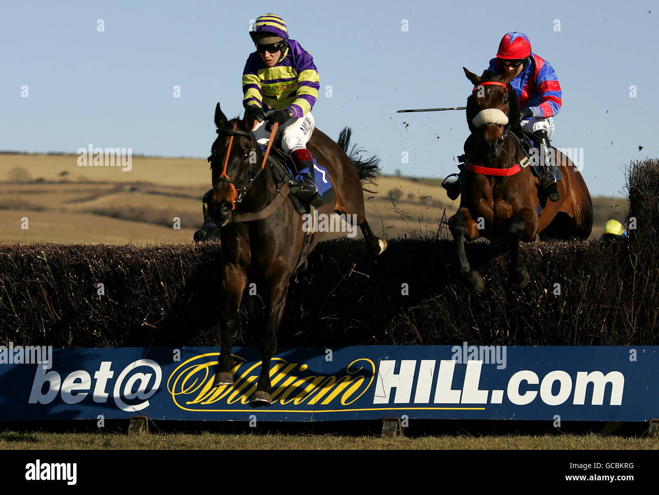Chapel Flowers ridden by jockey Richard Johnson (L) jumps the last to ...