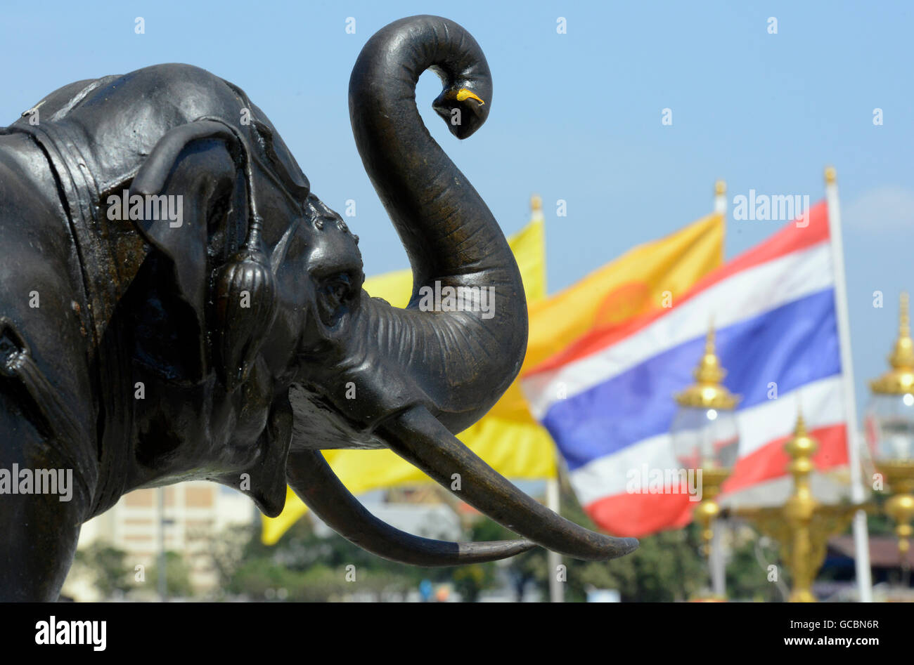 a elephant monument and a thai flag at the Wat Arun at the Mae Nam Chao ...