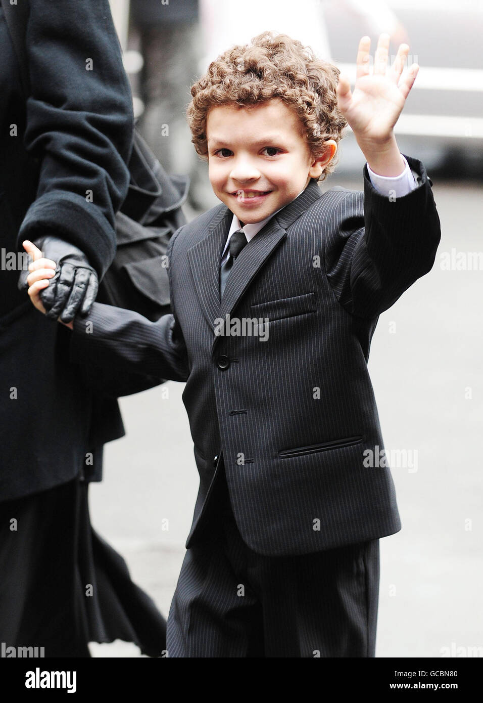Alex Bain (character name Simon Barlow) arrives at the memorial service ...