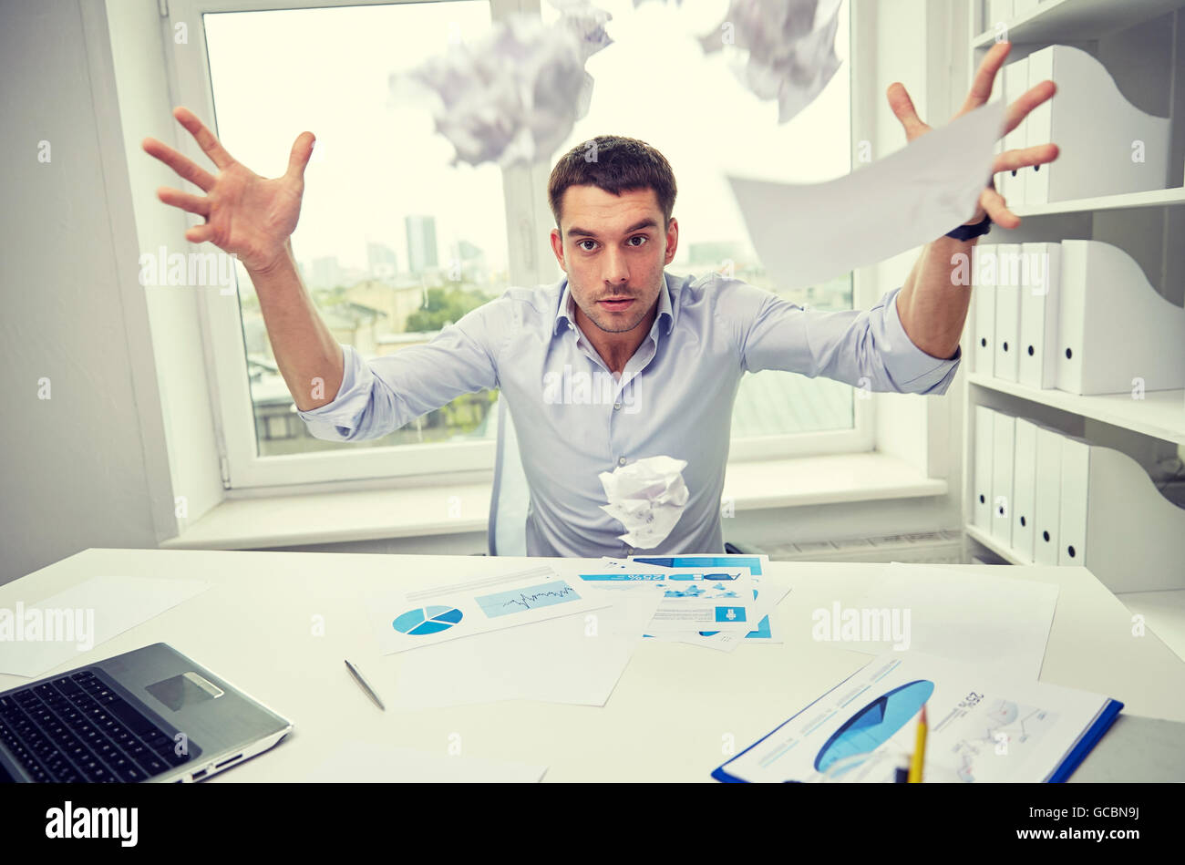 Furious man throwing chart papers hi-res stock photography and images ...