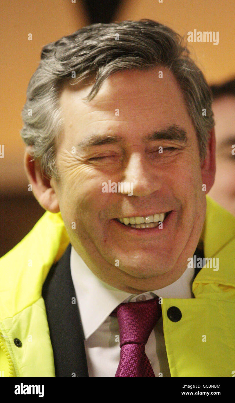 Prime Minister Gordon Brown speaks with staff during a visit to the ...