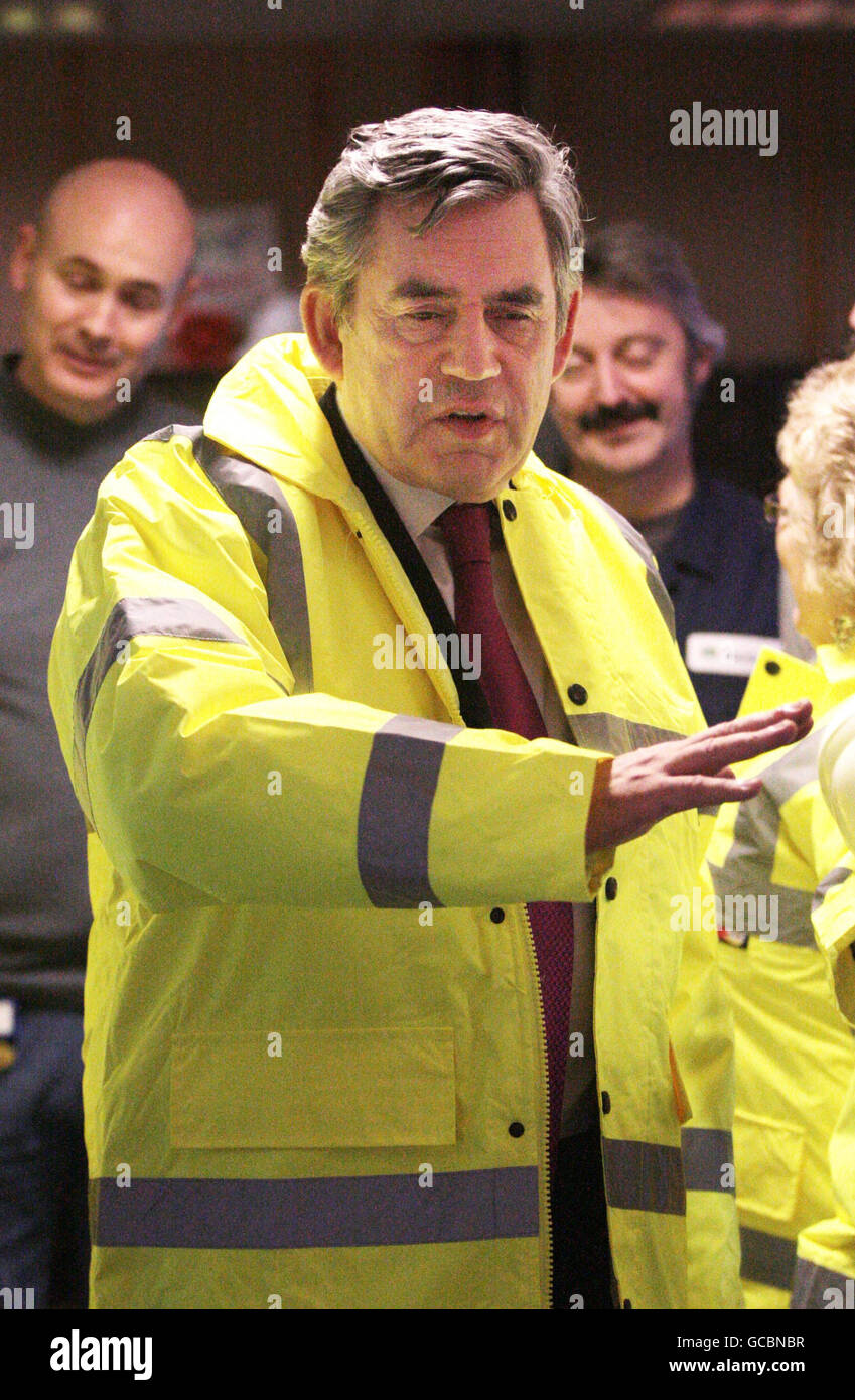 Prime Minister Gordon Brown speaks with staff during a visit to the ...