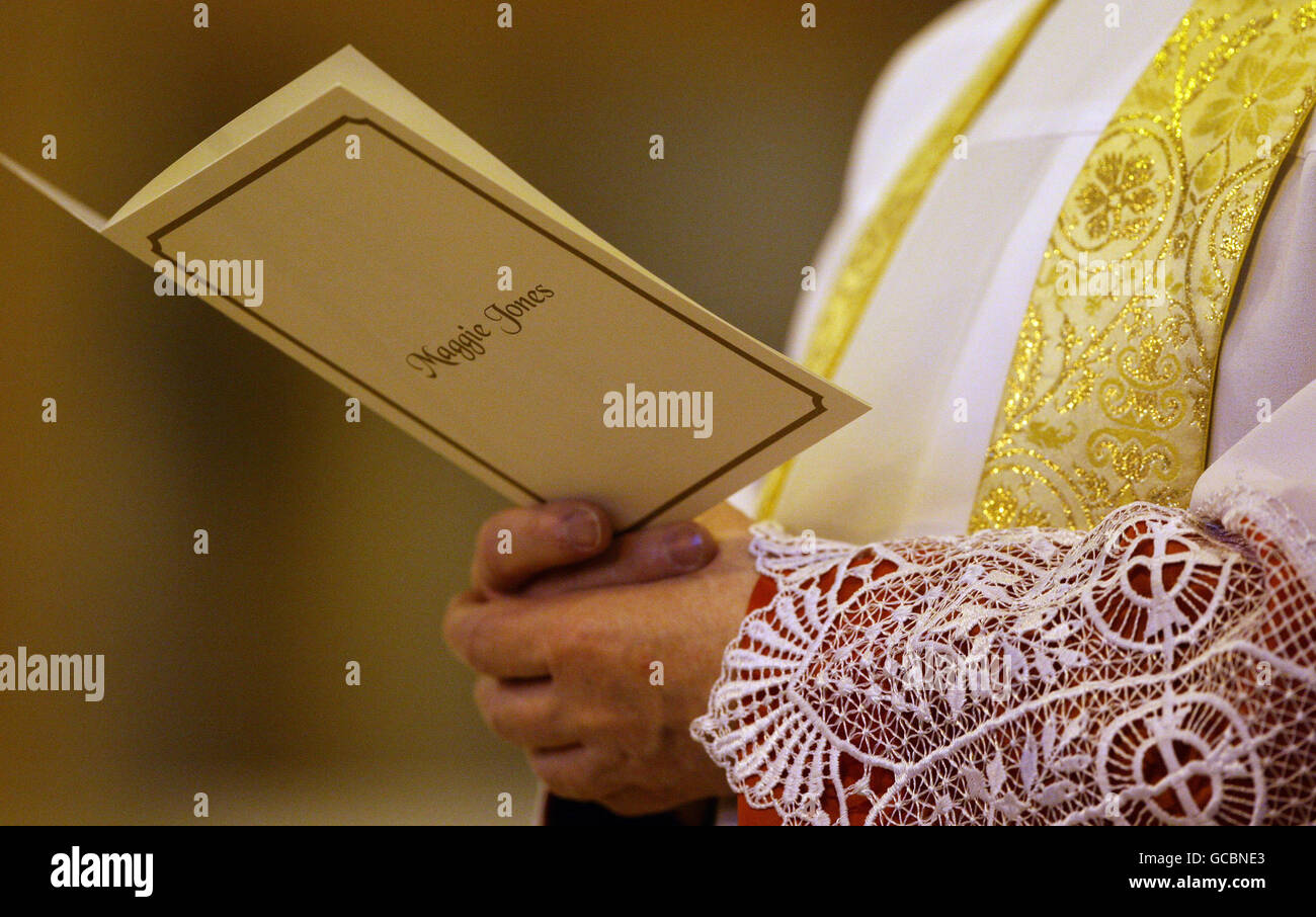 Canon Tony McBride reads from the order of service at the memorial ...