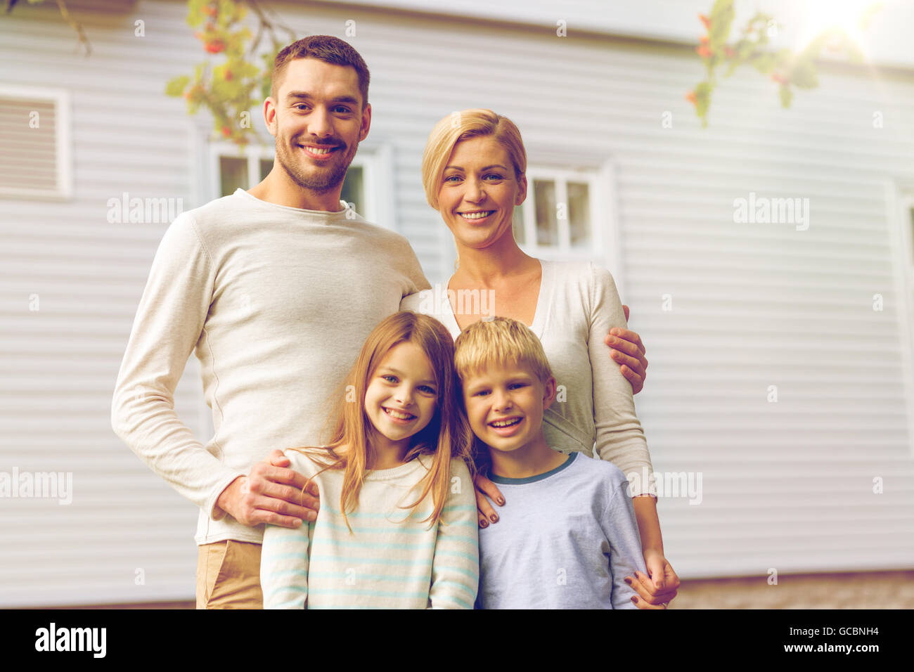happy family in front of house outdoors Stock Photo - Alamy