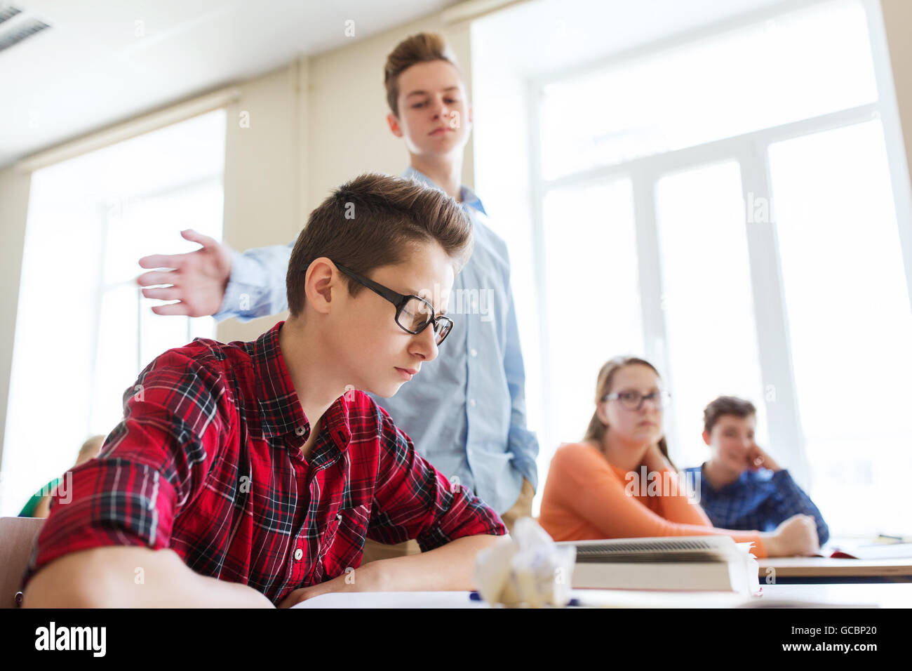 classmate offending student boy at school Stock Photo - Alamy