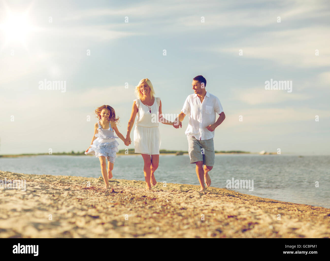 happy family at the seaside Stock Photo - Alamy