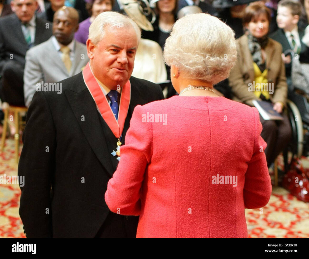 Former chief executive of HSBC Dyfrig John receives the CBE from Queen ...