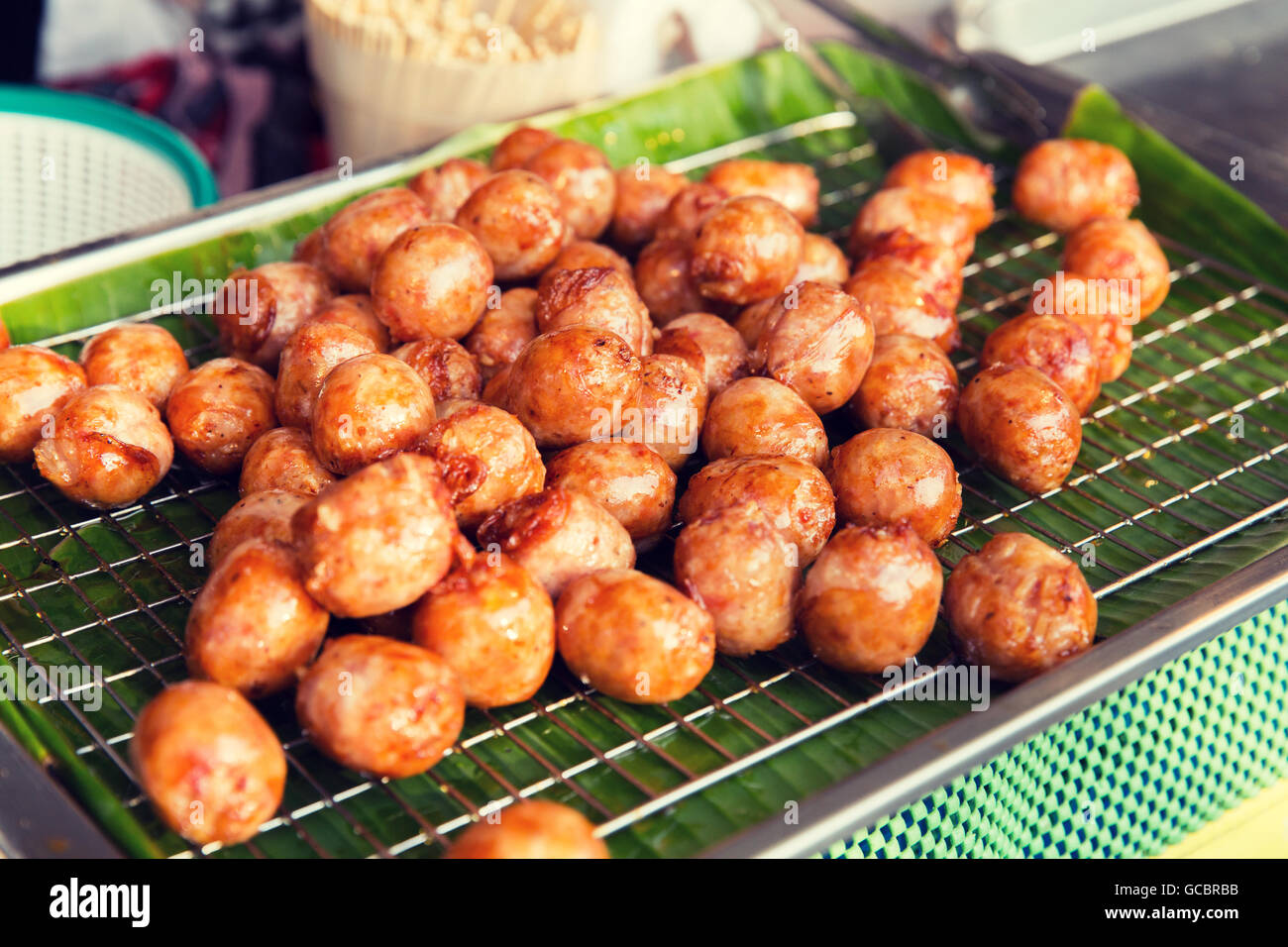 fried meatballs sale at street market Stock Photo - Alamy