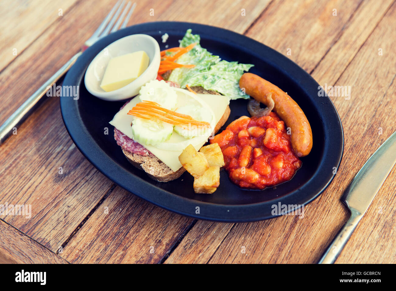 plate of different food on table Stock Photo - Alamy