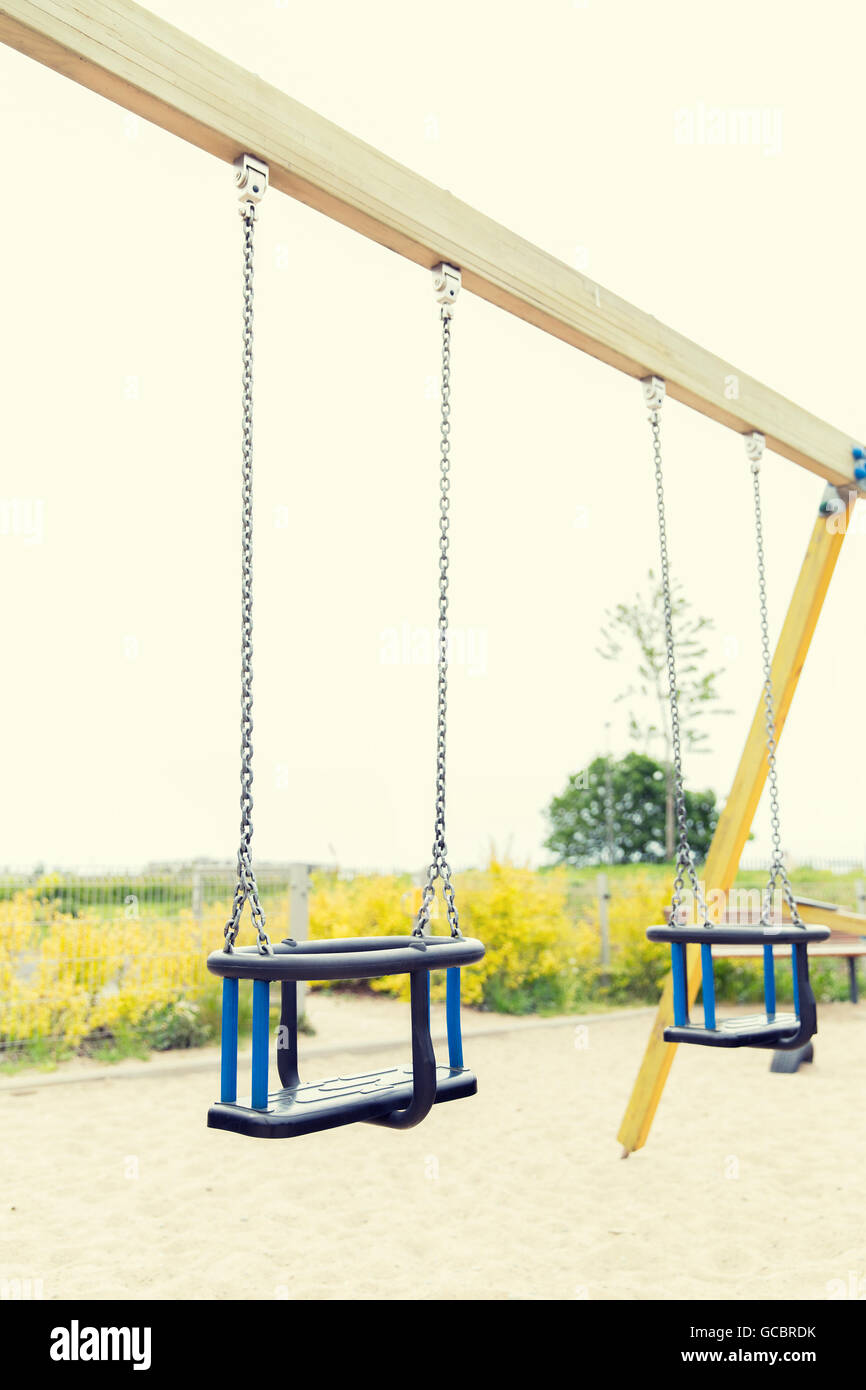 baby swing on playground outdoors Stock Photo - Alamy