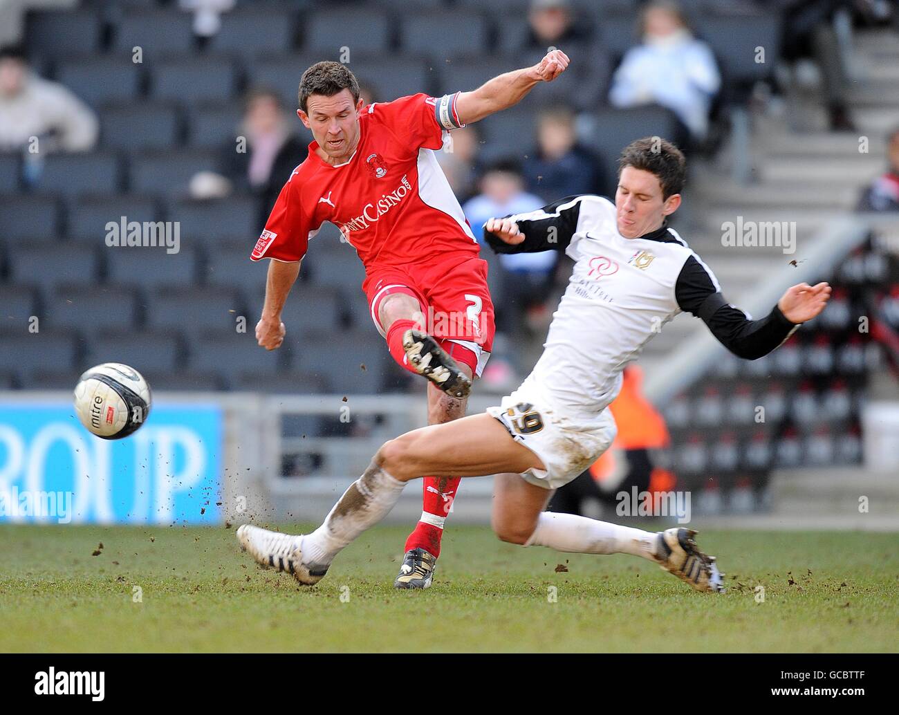 Milton Keynes Dons' Mark Randall and Leyton Orient's Stephen Purches ...