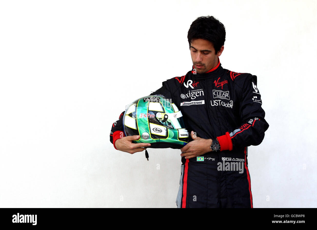 Race car driver holding helmet hi-res stock photography and images - Alamy