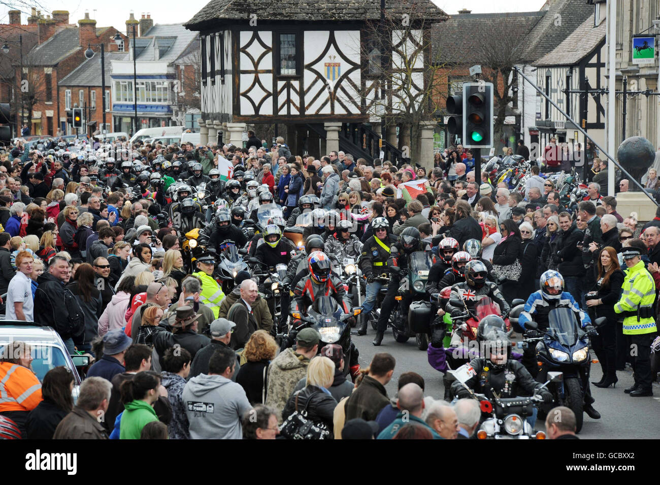 Crowds gather to show their support as bikers take part in a mass ...