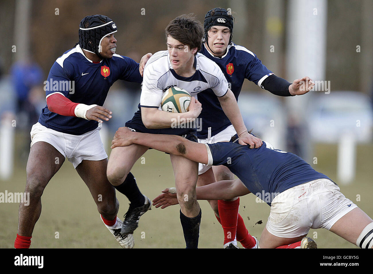 Scotland under 18's Harry Leonard (centre) tries to break through the ...