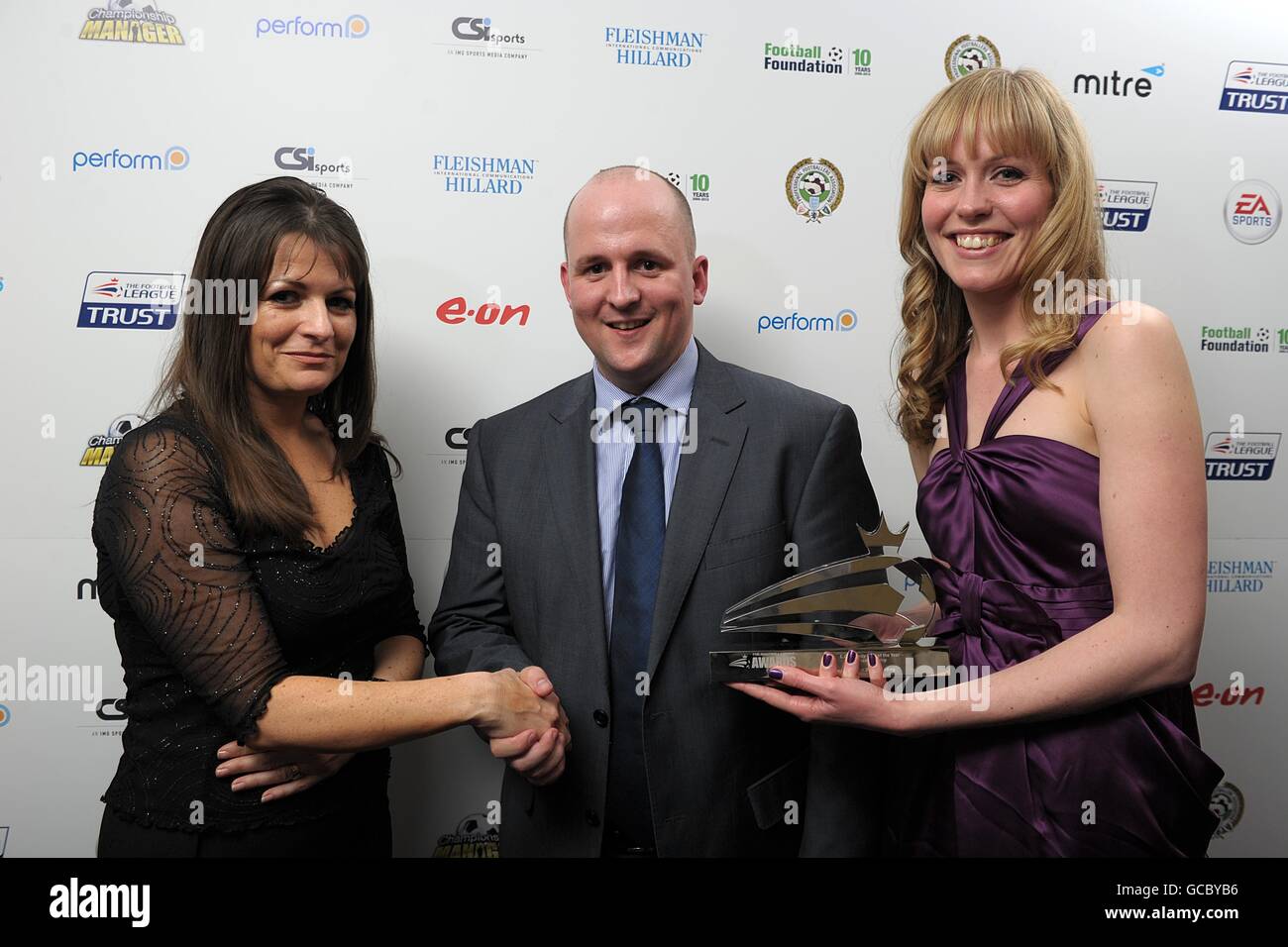 Jackie Evans and Sara Jacob collect the E.ON Family Club of the Year ...