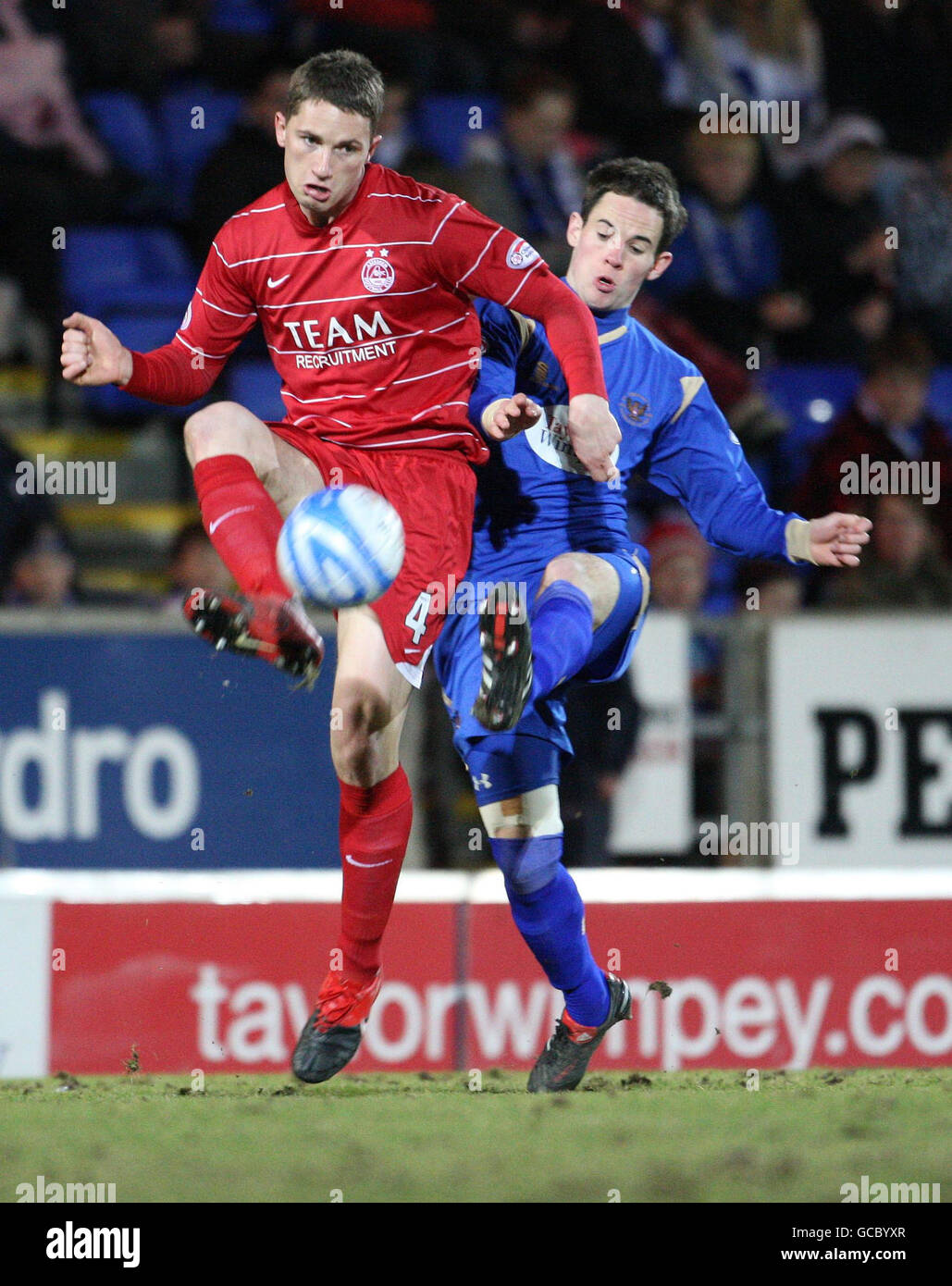 Aberdeen's Kevin McDonald and St Johnstone's Kevin Moon (right) battle ...