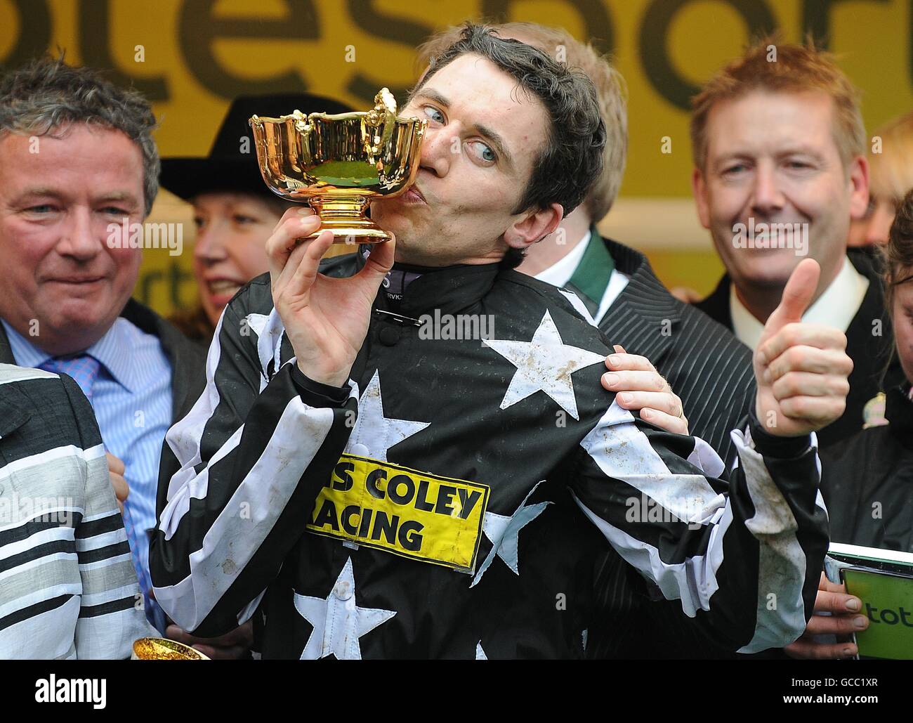 Jockey Paddy Brennan kisses the Gold Cup Trophy after winning the ...