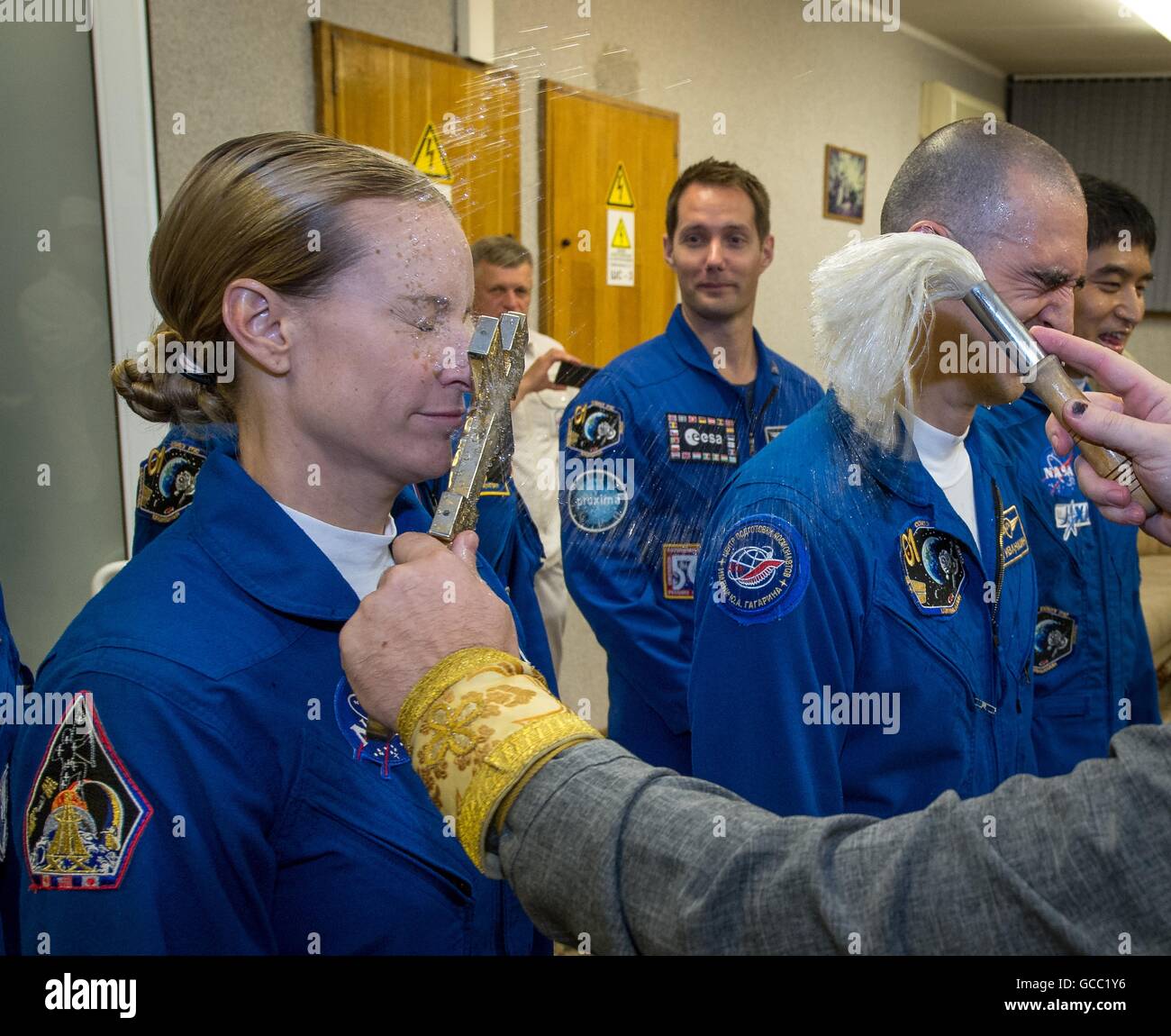 American astronaut Kate Rubins receives a traditional blessing from a ...