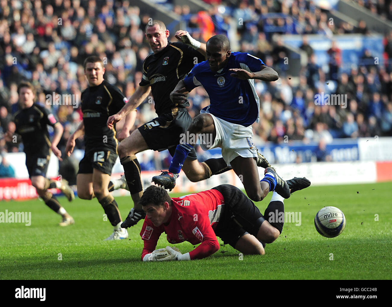 Coventry City's goalkeeper Chris Weale makes a save from Leicester City ...