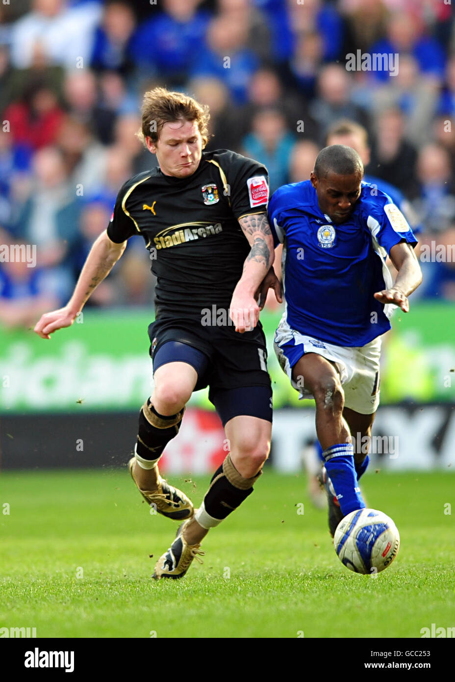 Leicester City's Lloyd Dyer and Coventry City's Aron Gunnarsson battle ...