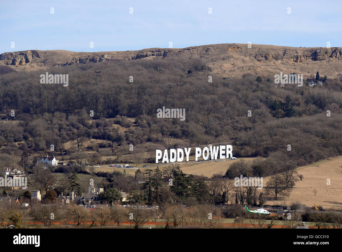 A Giant Paddy Power sign is seen on the hillside next to Cheltenham ...