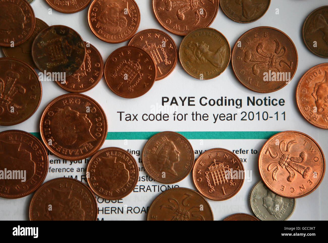 A paye tax code notice surrounded by 2p 1p coins hi-res stock ...