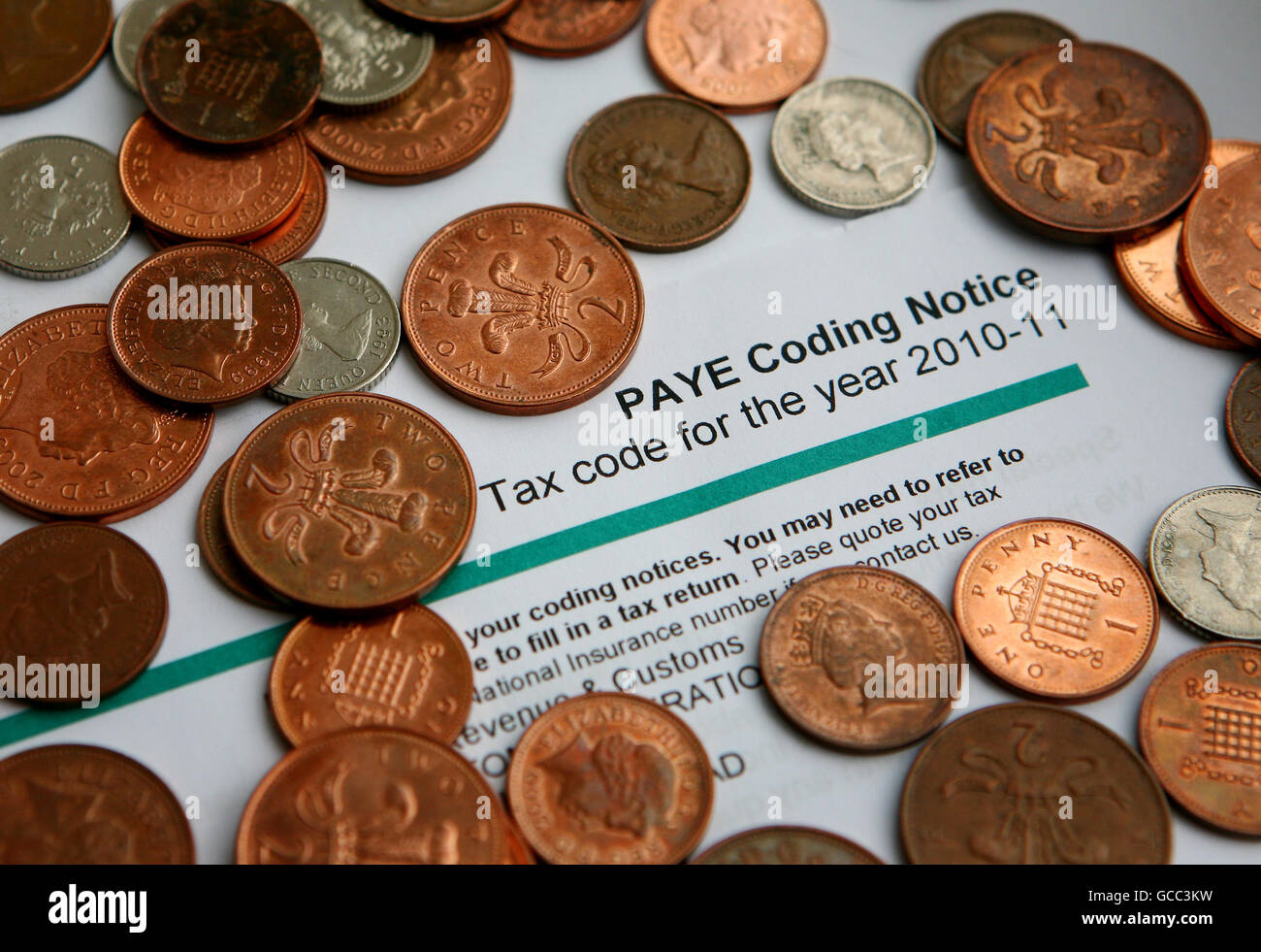 A paye tax code notice surrounded by 2p 1p coins hi-res stock ...