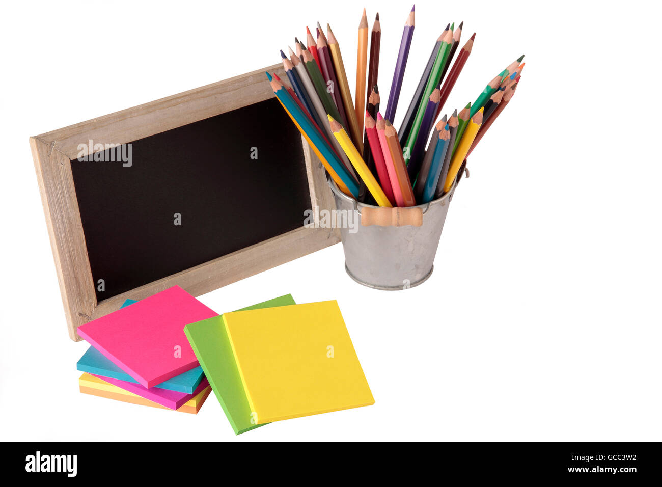 notes, blackboard and colored pencils isolated on white background ...