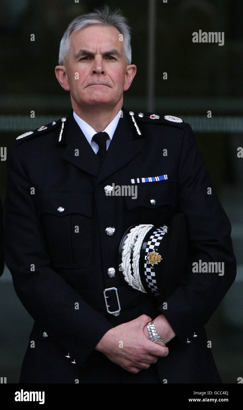Chief Constable of Greater Manchester Police, Peter Fahy, reads a ...