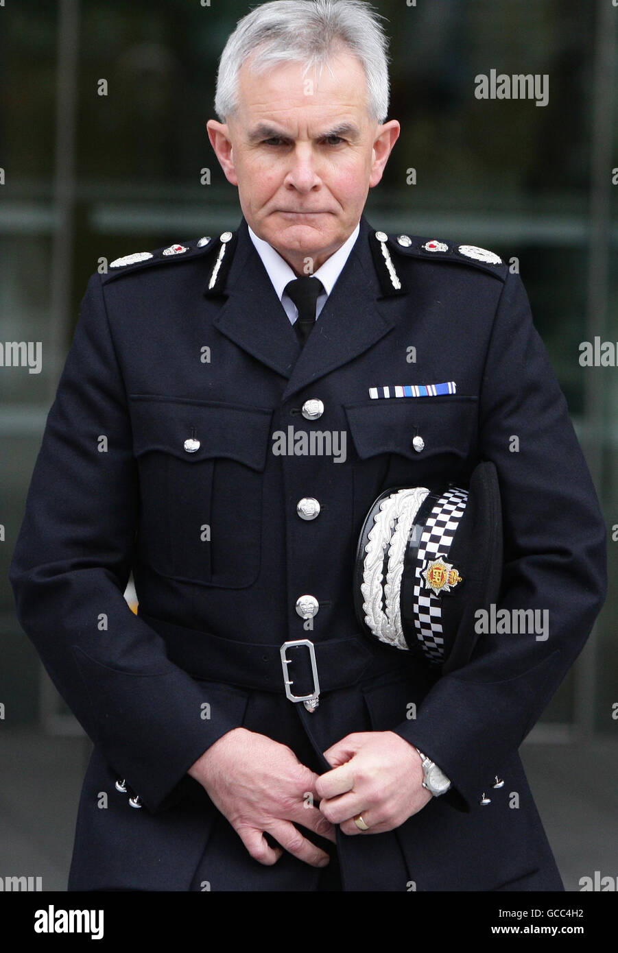Chief Constable of Greater Manchester Police, Peter Fahy, reads a ...