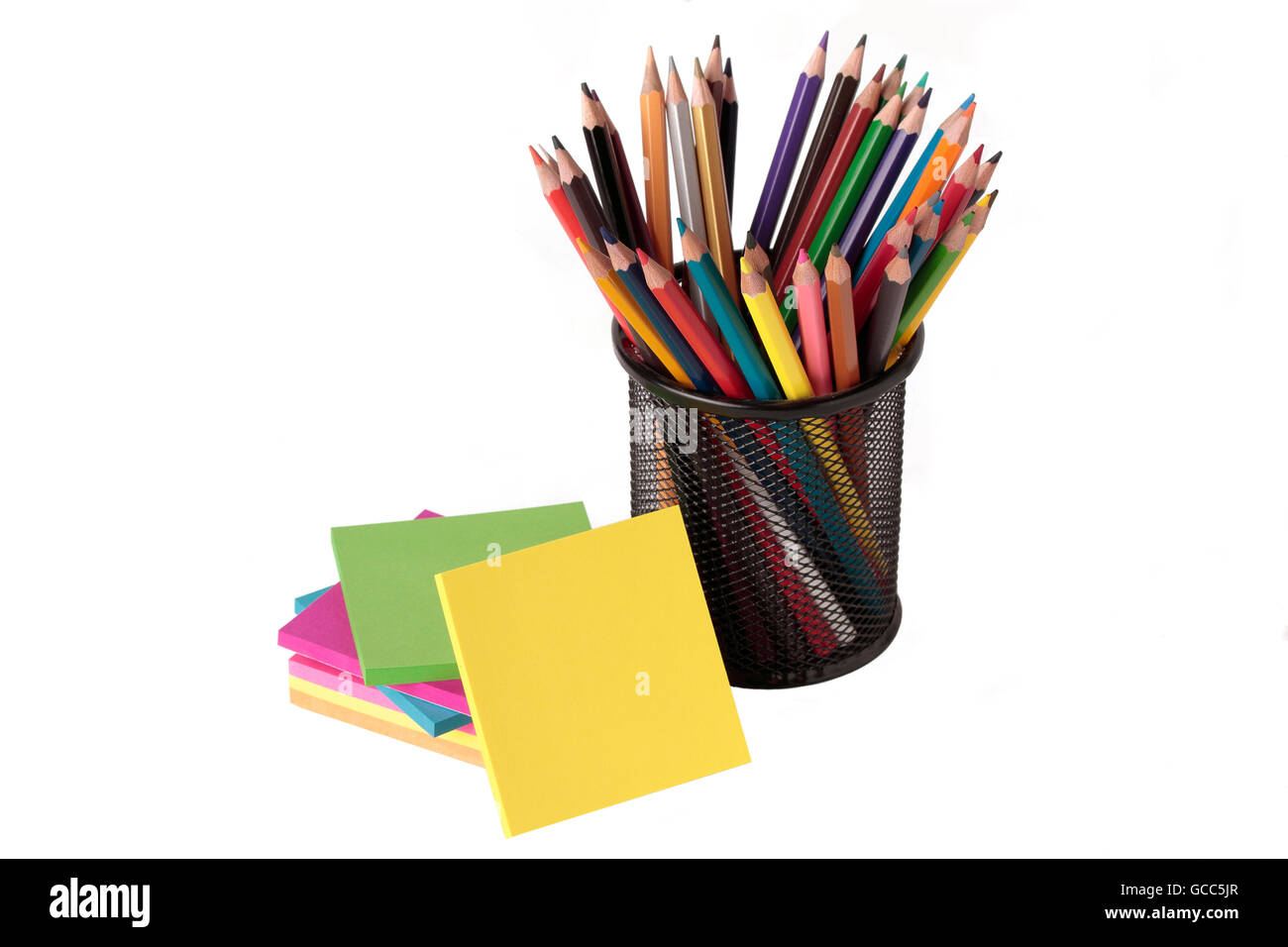 notes and colored pencils isolated on white background Stock Photo - Alamy
