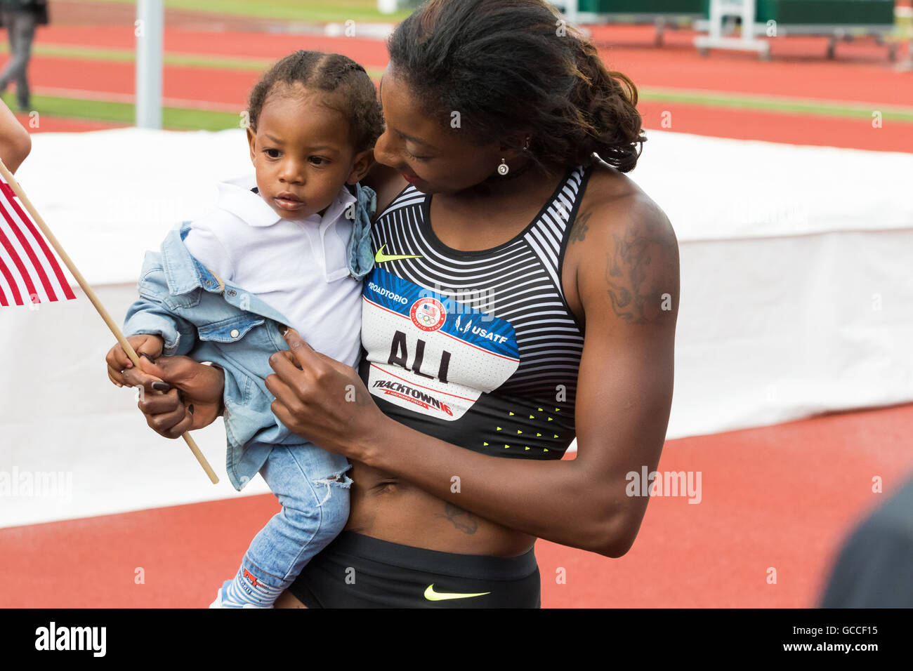 Eugene, USA. 8th July, 2016. Nia Ali holds her baby on the track after ...
