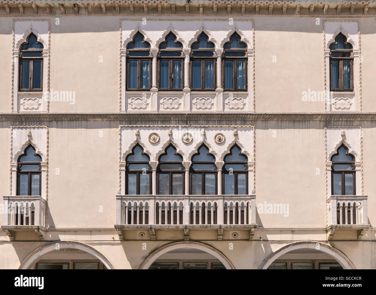 Decorated arched windows of a medieval building Stock Photo - Alamy