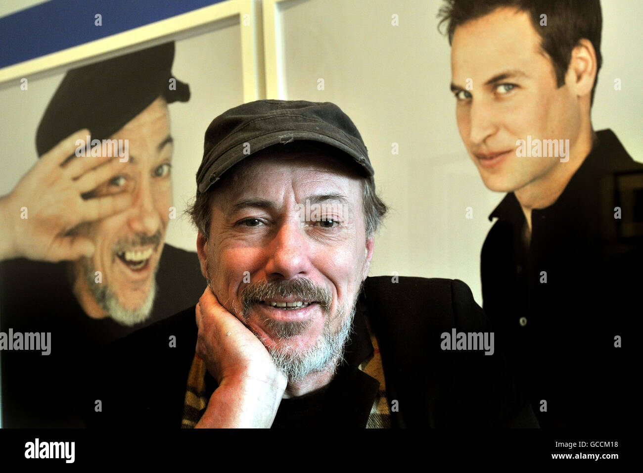 Jeff Hubbard, 54, poses with his portrait taken by Prince William and a ...