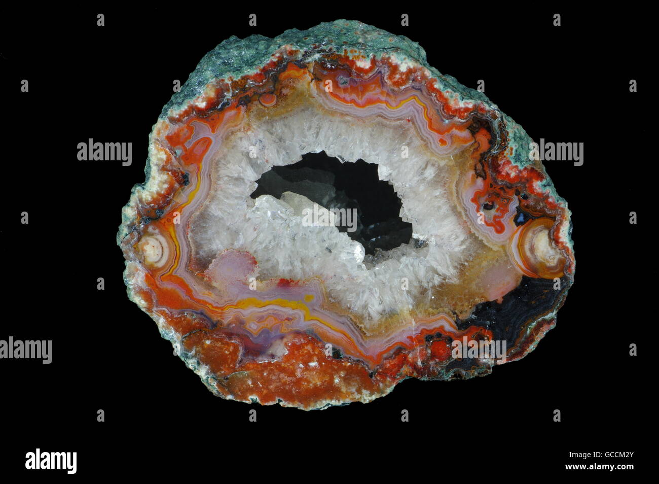 A cross section of the agate stone with geode on the black background ...