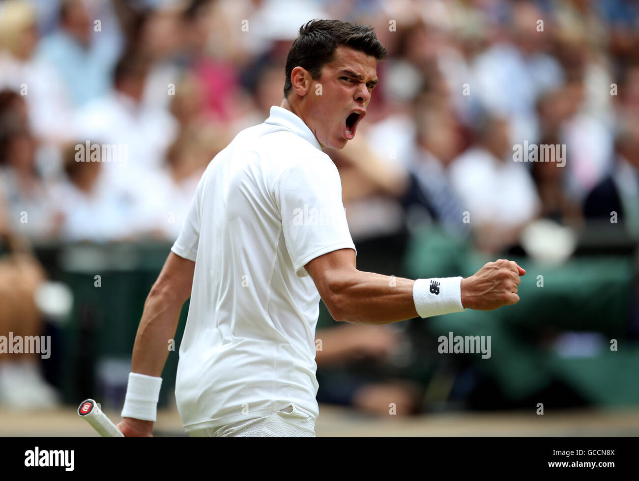 Milos Raonic celebrates holding serve in the fourth set against Roger ...