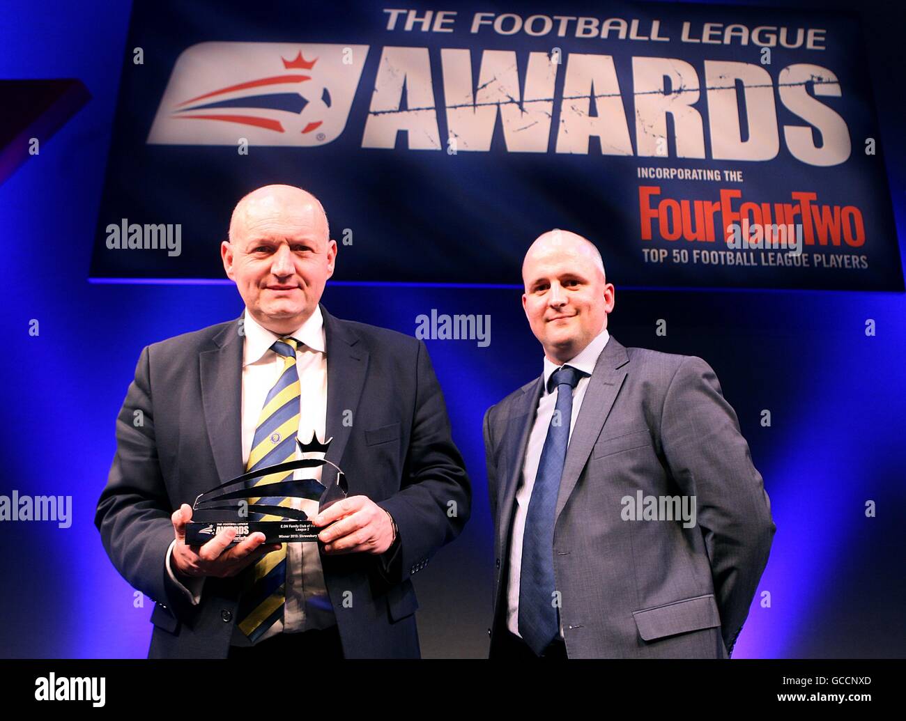 Shrewsbury Town's general manager Jonathan Harris (left) collects the ...