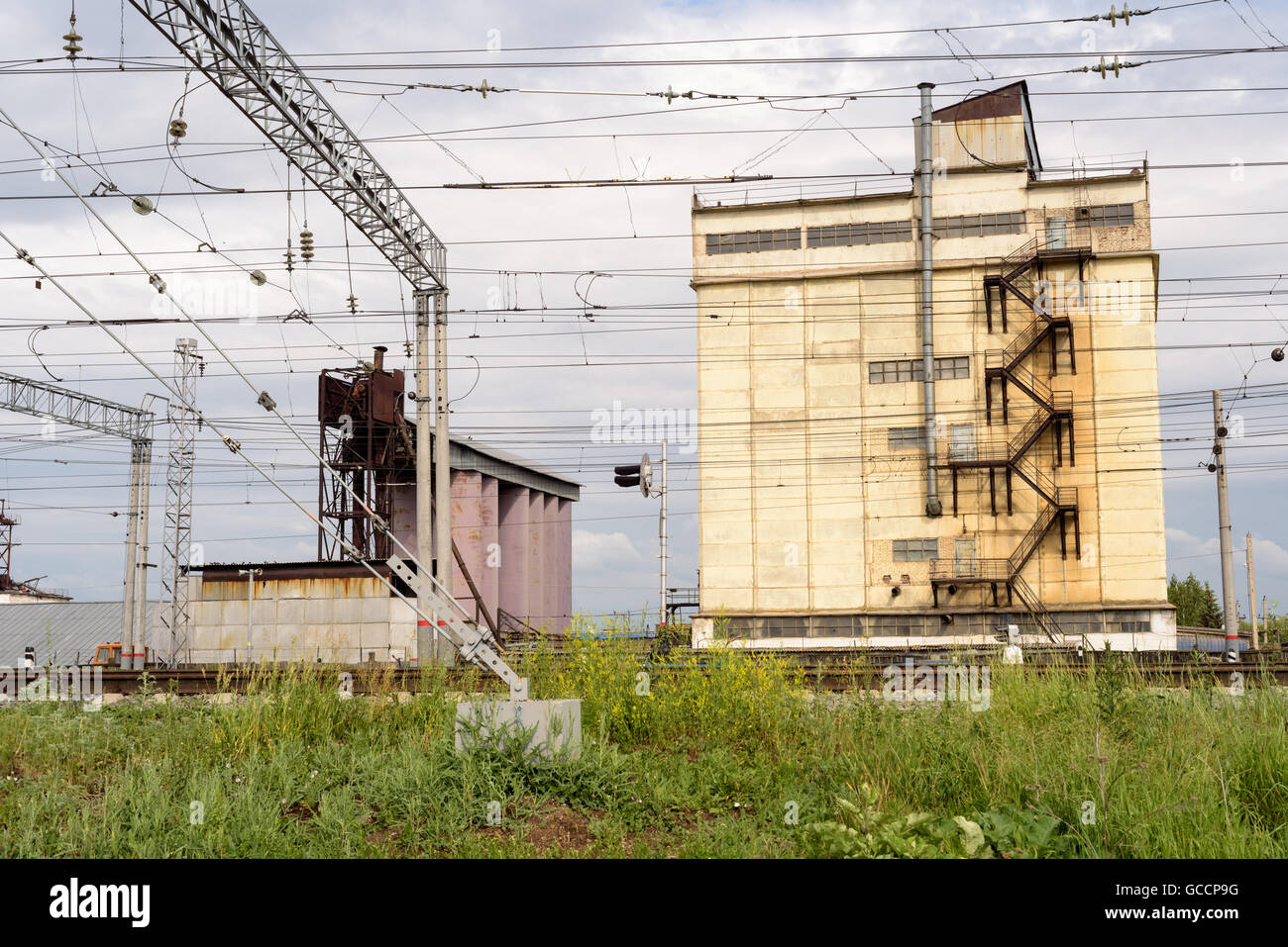 Train track and soviet era factory building Stock Photo - Alamy