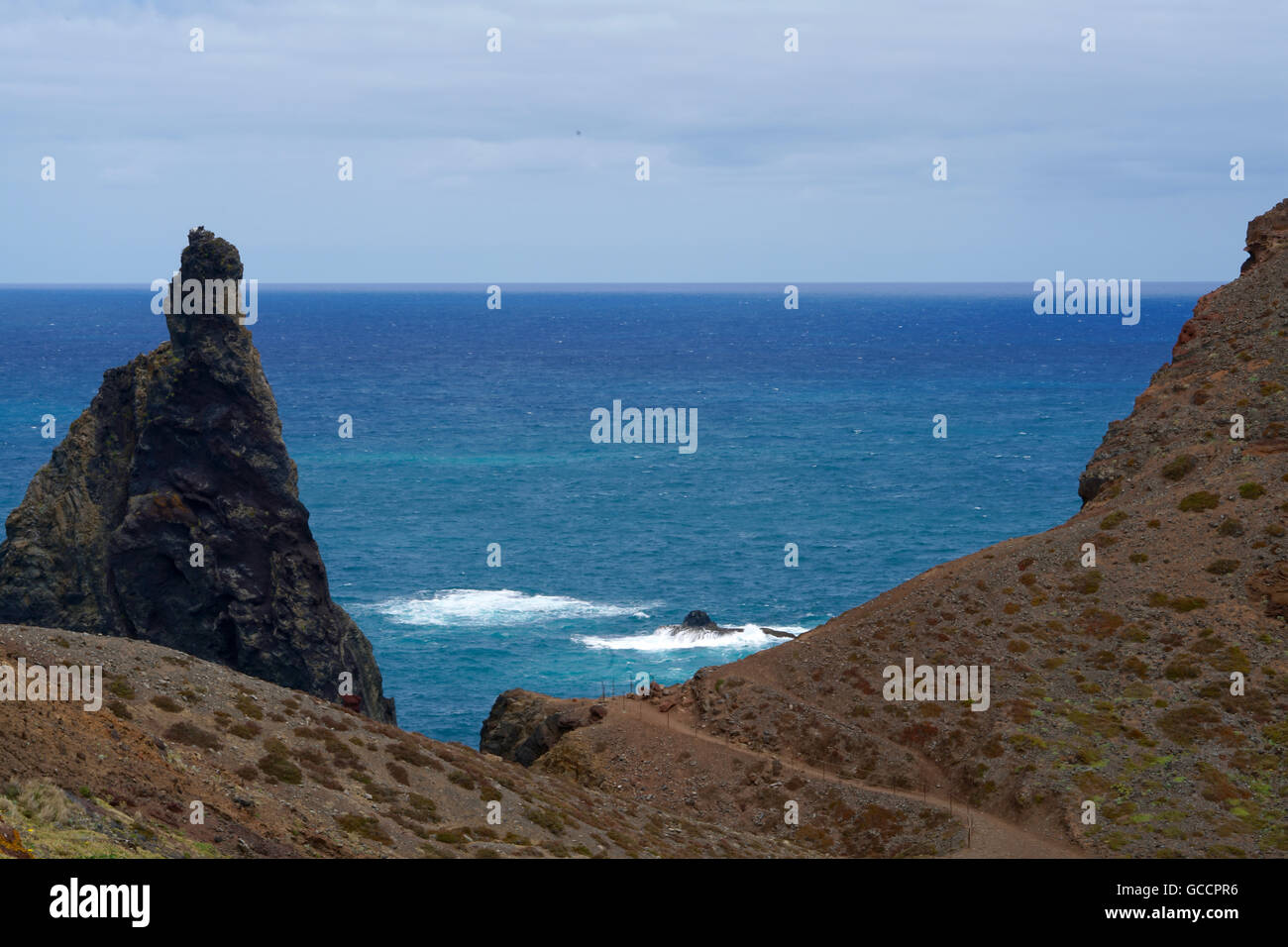 view through the rocks of Madeira to the ocean Stock Photo - Alamy