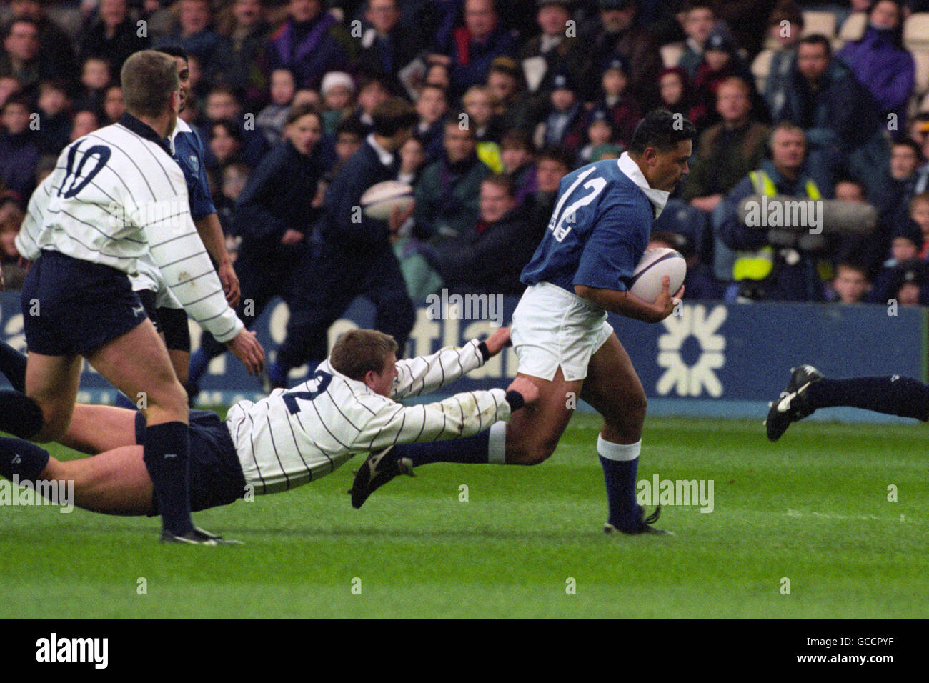 SCOTLAND'S ANDREW SHIEL TAKES A FLYING TACKLE TO GEORGE LEAUPEPE OF ...