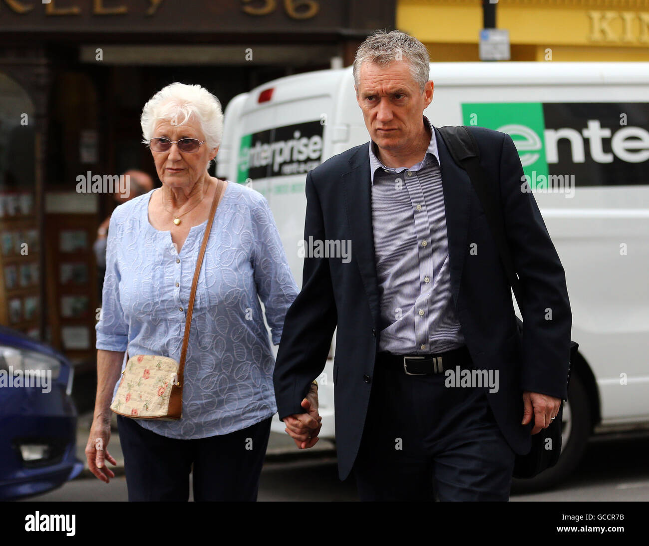 Maureen Lock (left) widow of Donald Lock, and her son Andrew, arrive at ...