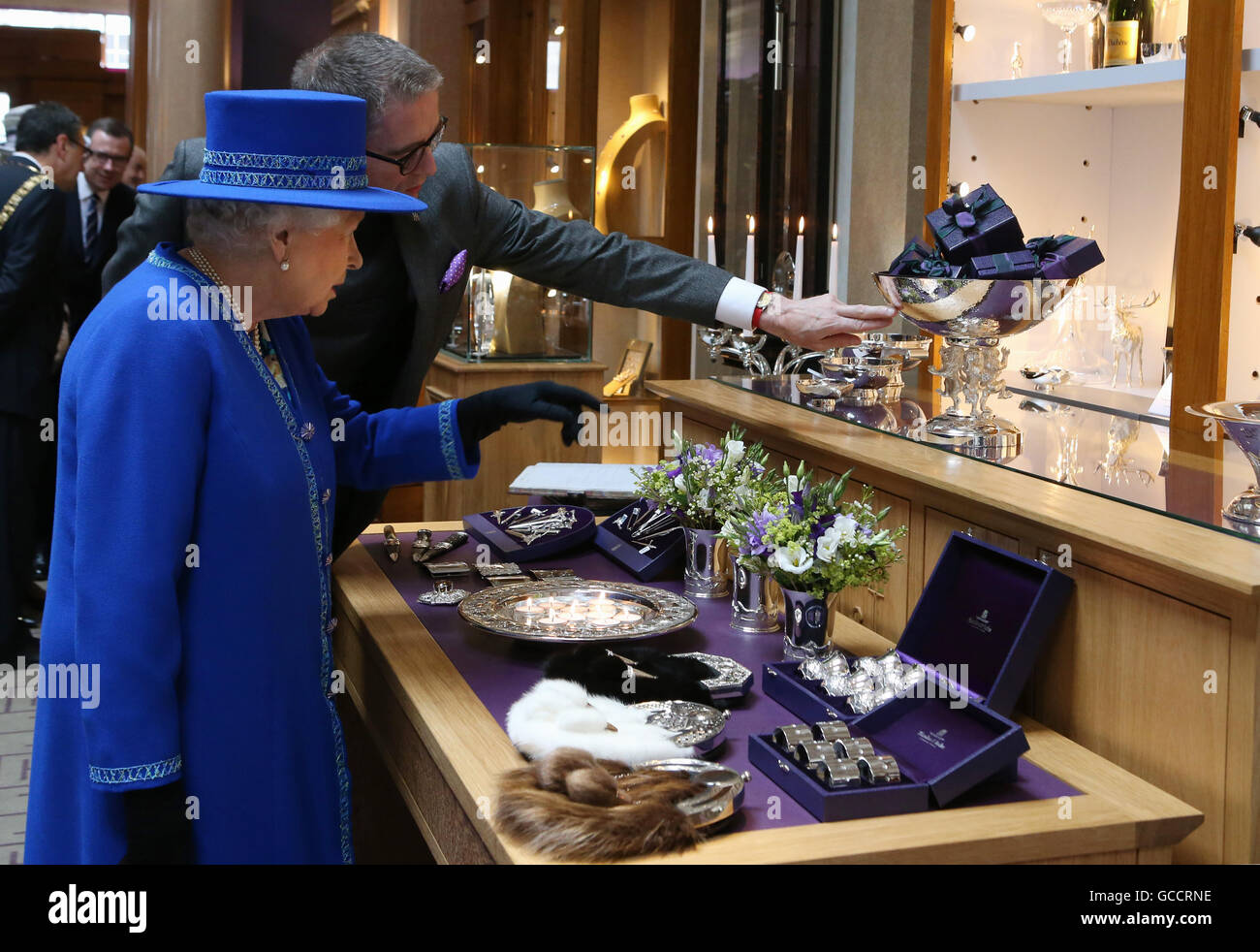 Queen Elizabeth II with Chief Executive Stephen Paterson during a visit ...